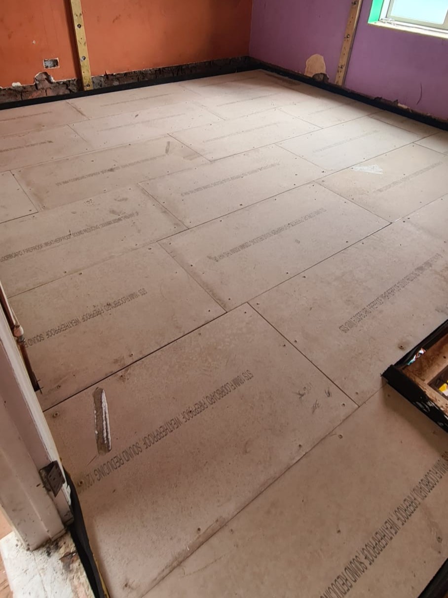 Layer of cement fibre boards laid onto EAFM mounts - Mason UK